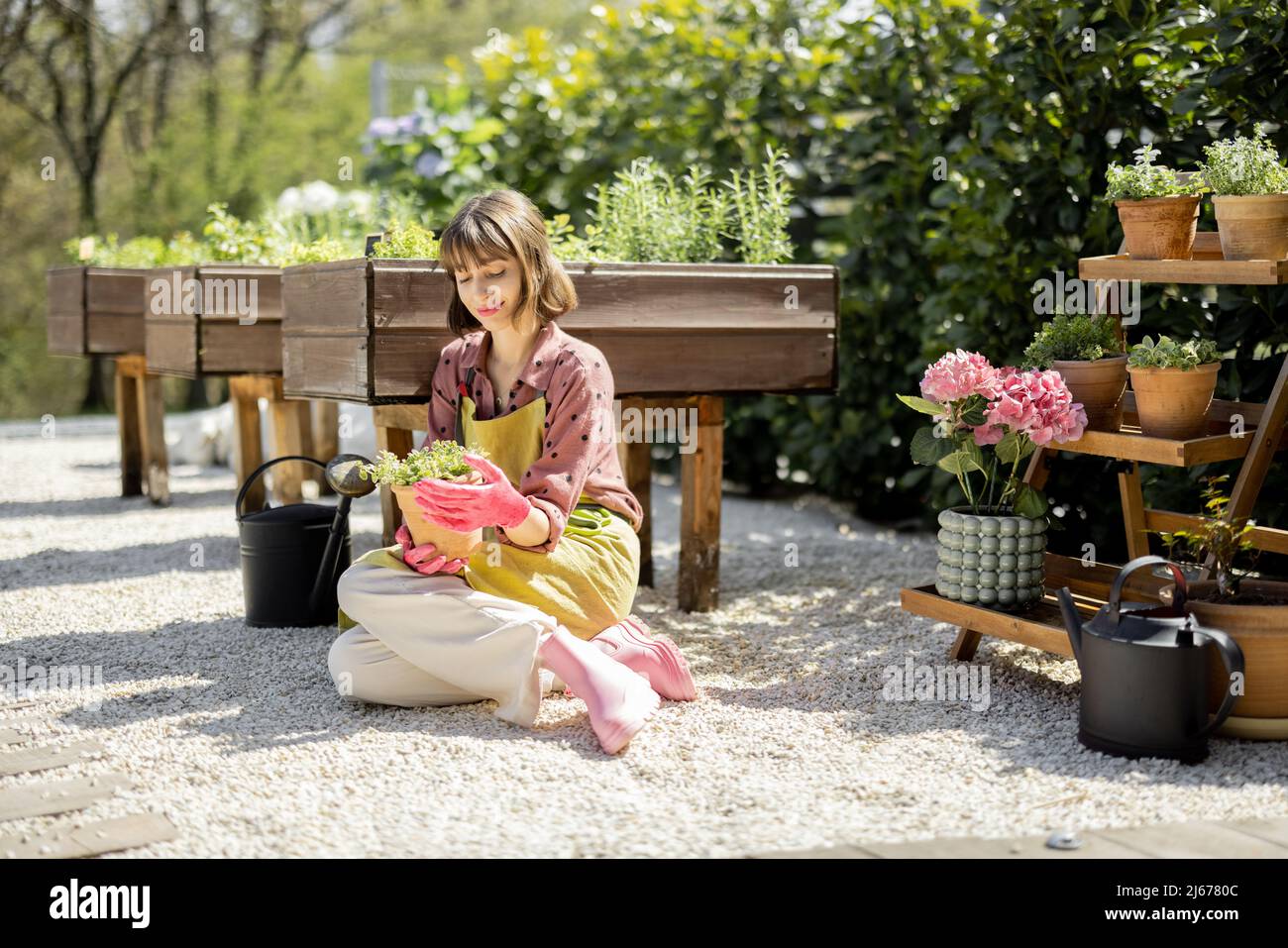 Portrait of young gardener at backyard Stock Photo - Alamy