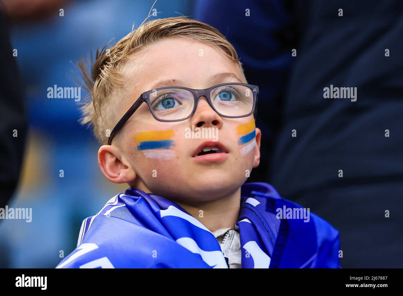 Leicester, UK. 28th Apr, 2022. A young Leicester City fan with face ...