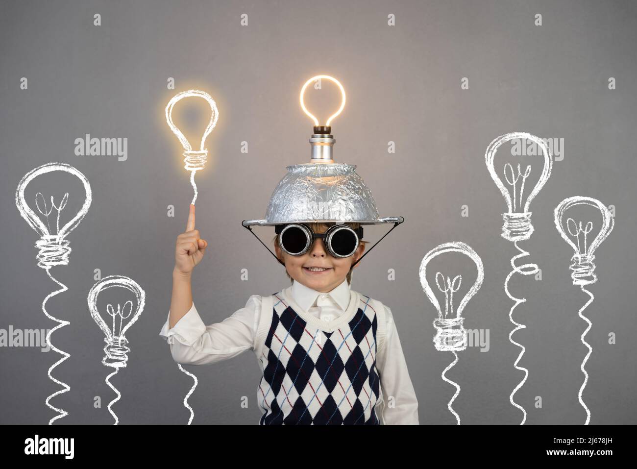 Smart child pretend to be businessman. Funny kid wearing helmet with ...