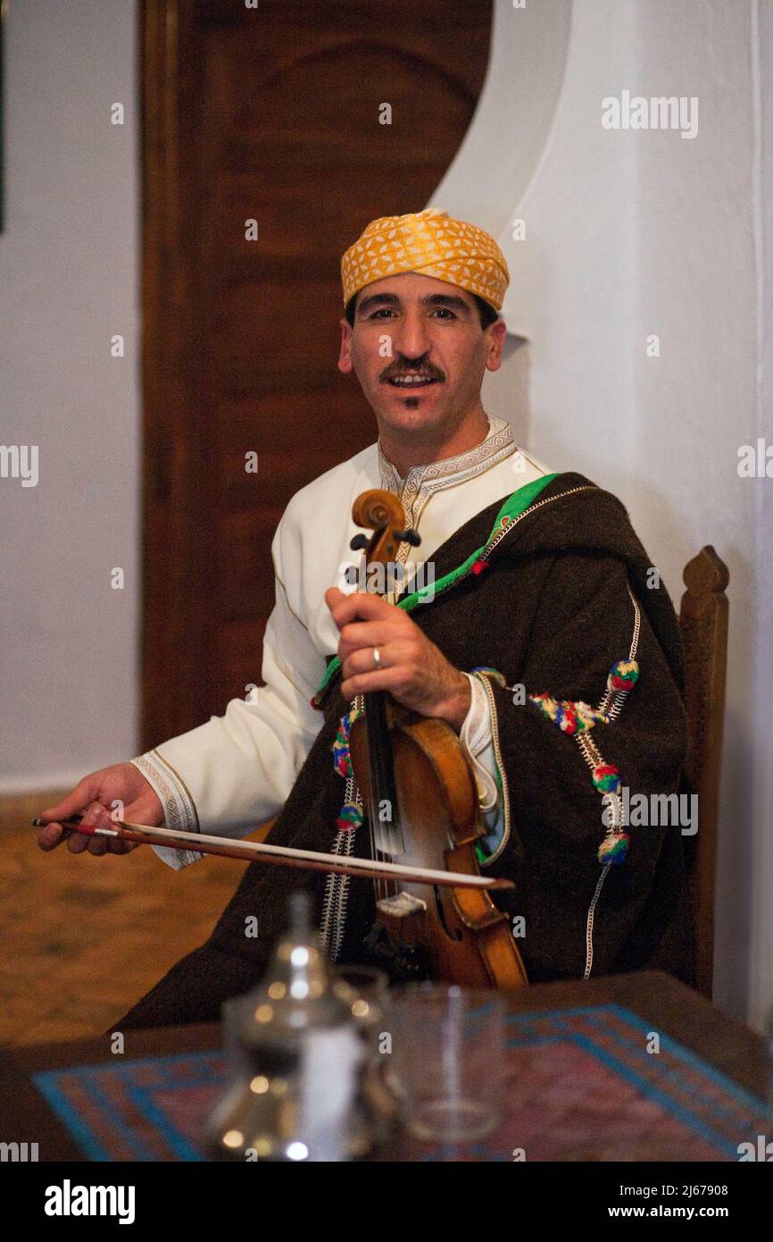 Musician plays in Chefchaouen, Morocco Stock Photo - Alamy