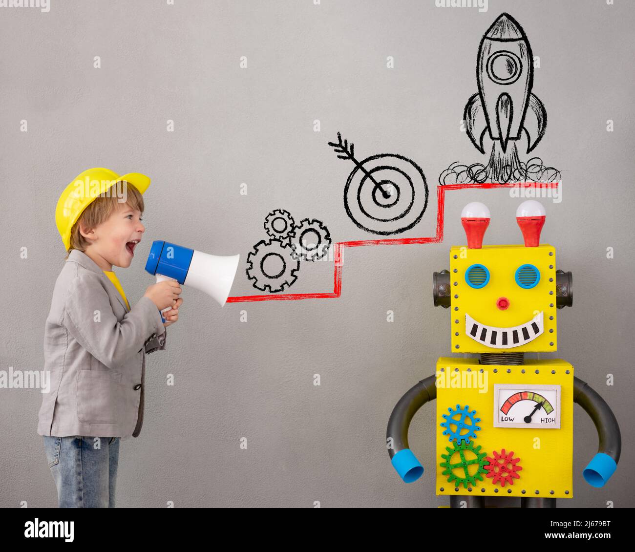 Happy child with robot. Funny kid playing at home. Boy shouting over ...