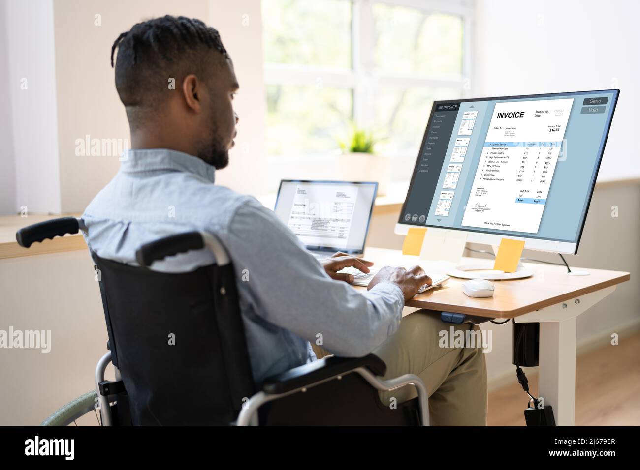 African Accountant With Disability Working On Computer In Wheelchair ...
