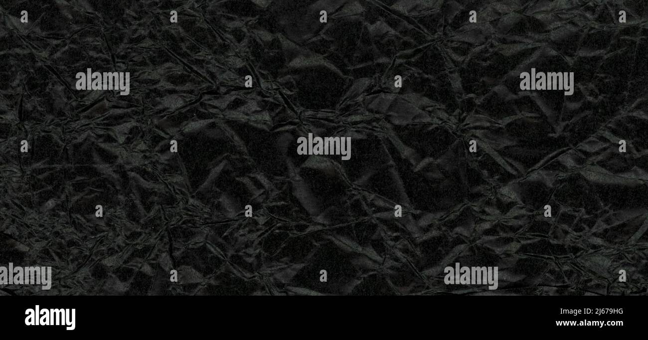 black crumpled paper texture useful as a background Stock Photo - Alamy