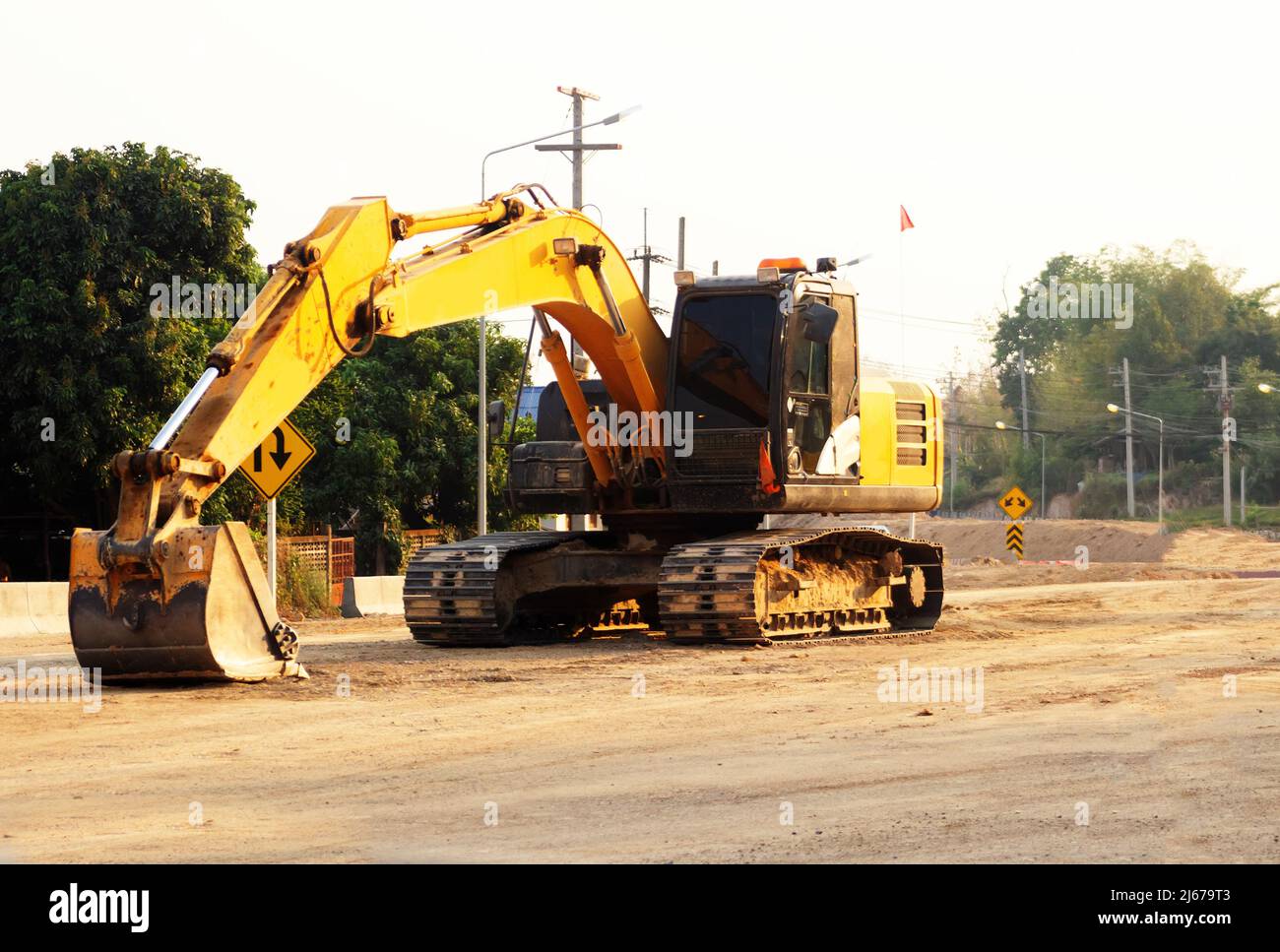 Road construction. Road works and road equipment. Excavator operation ...