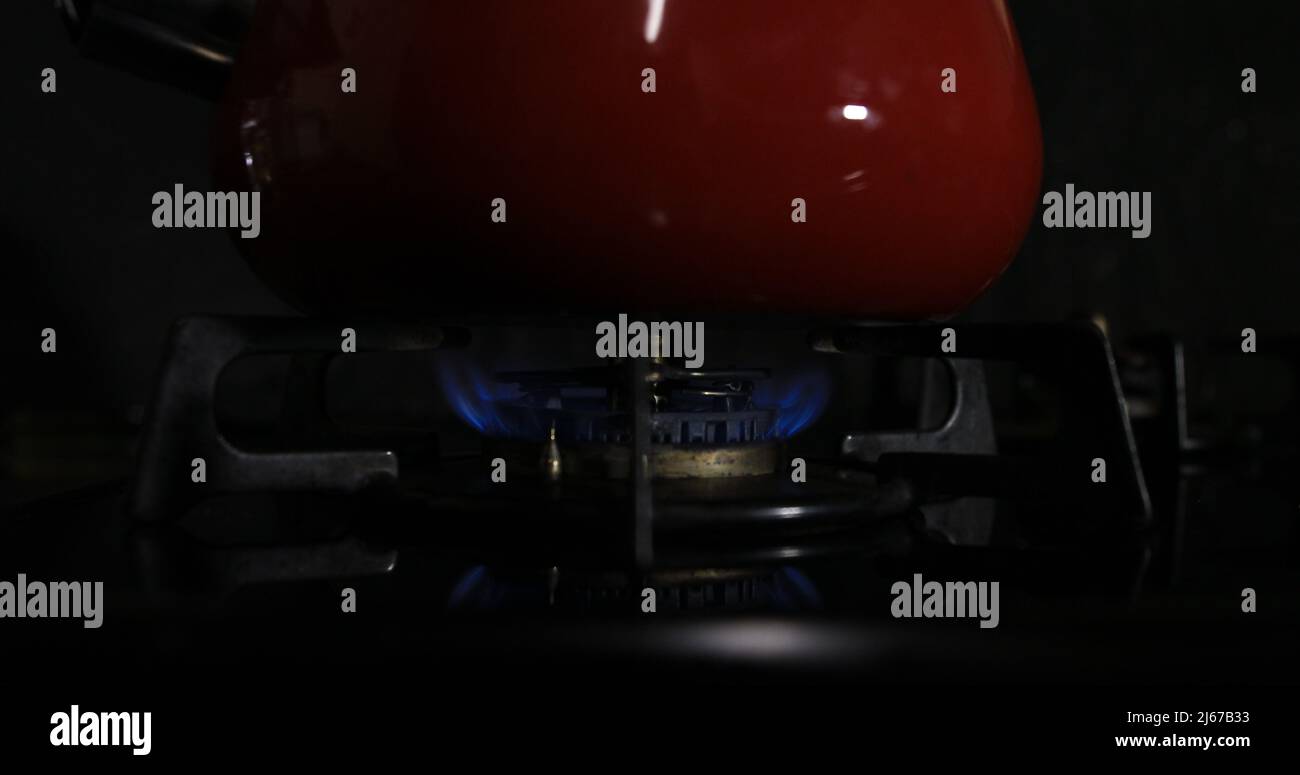 Ignition of the heat under the pot in the kitchen Stock Photo - Alamy