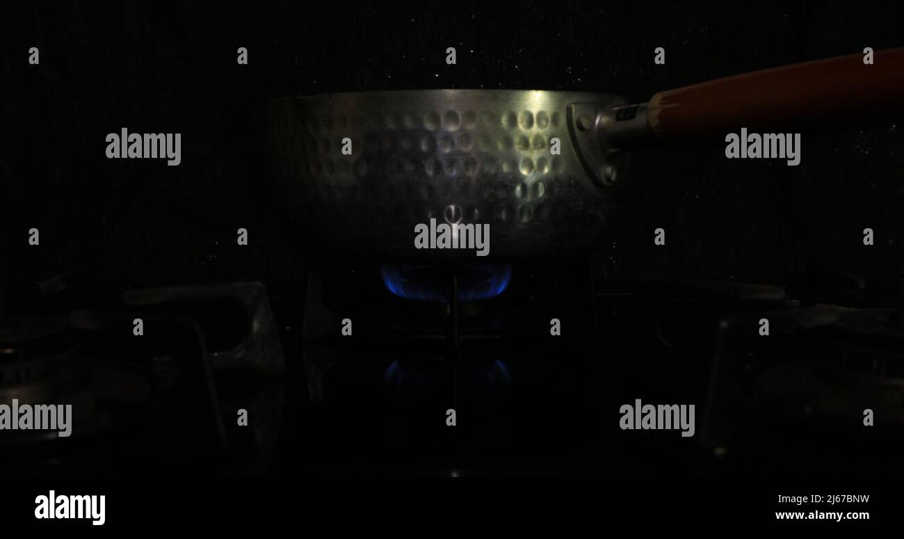 Ignition of the heat under the pot in the kitchen Stock Photo - Alamy