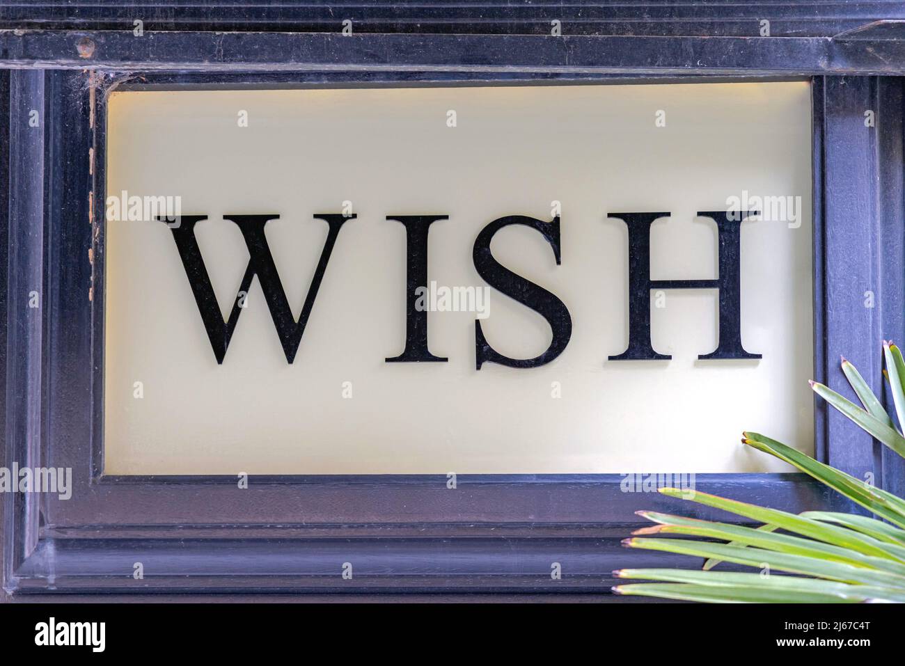Black Letters Sign Wish in Wooden Frame Stock Photo - Alamy