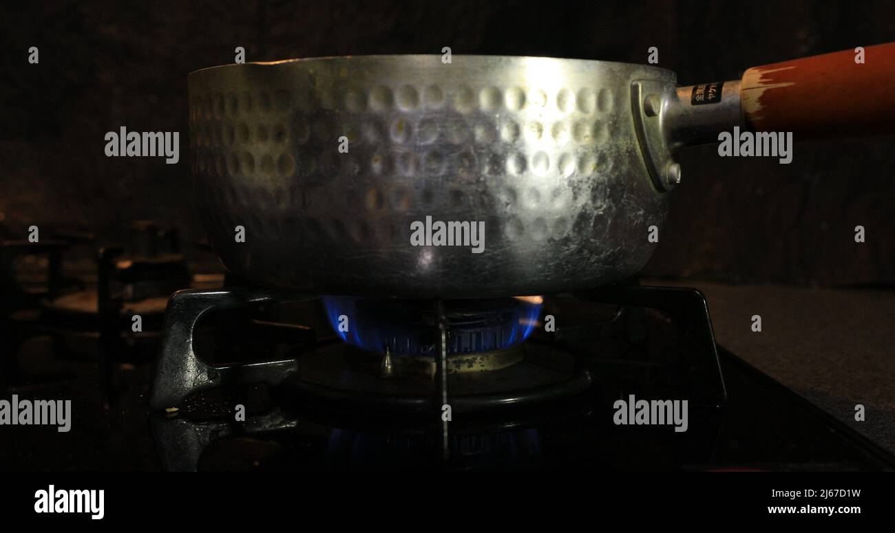 Fire burning under pot hi-res stock photography and images - Alamy