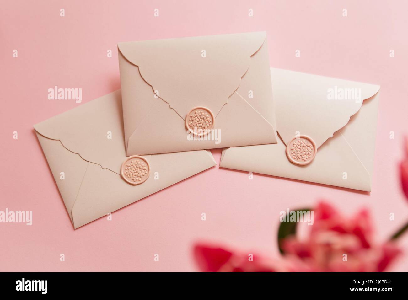 Photography from above of several gift certificates. Tender pink color ...
