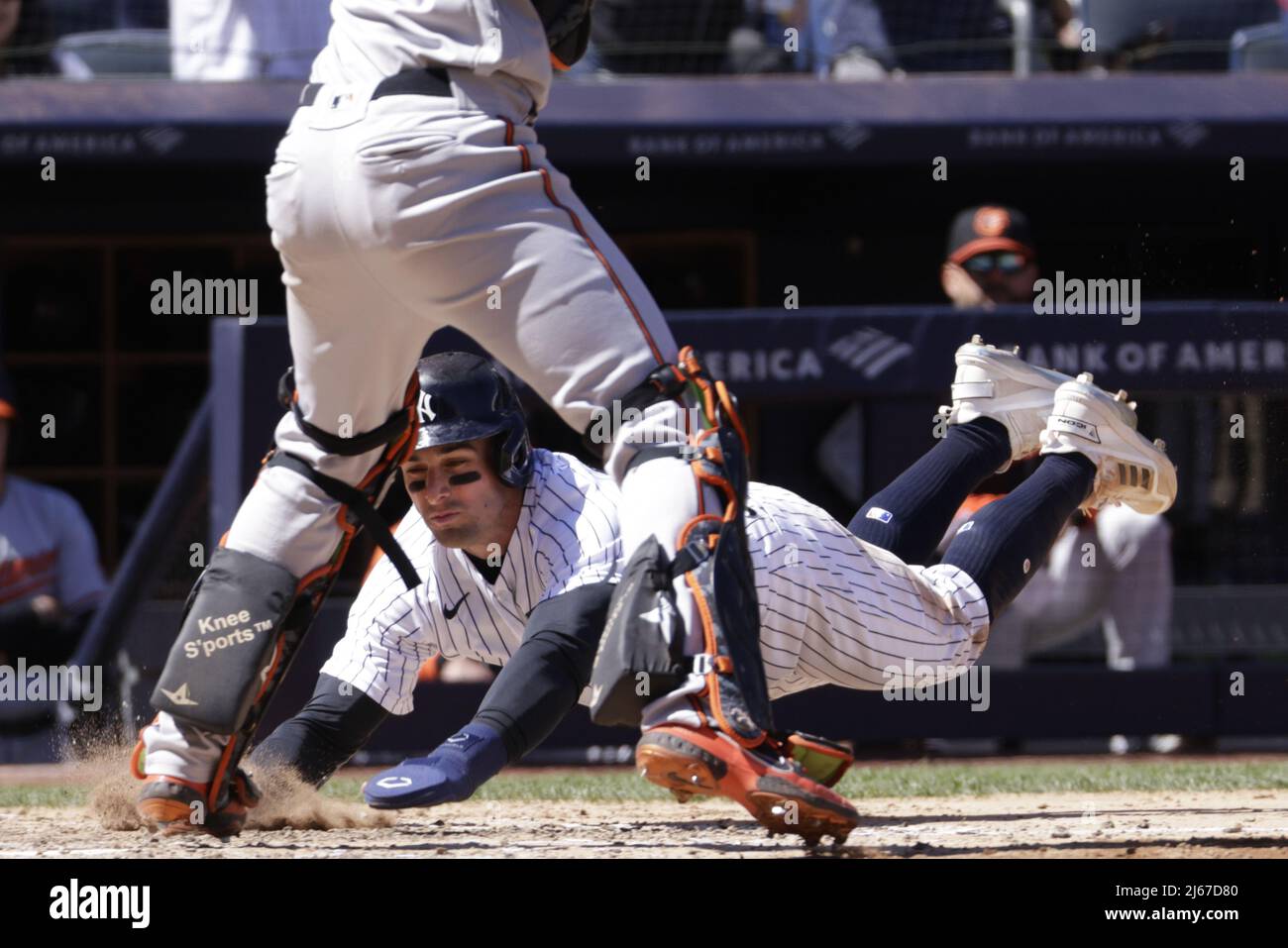 New York Yankees Tim Locastro dives home on a Marwin Gonzalez double in ...