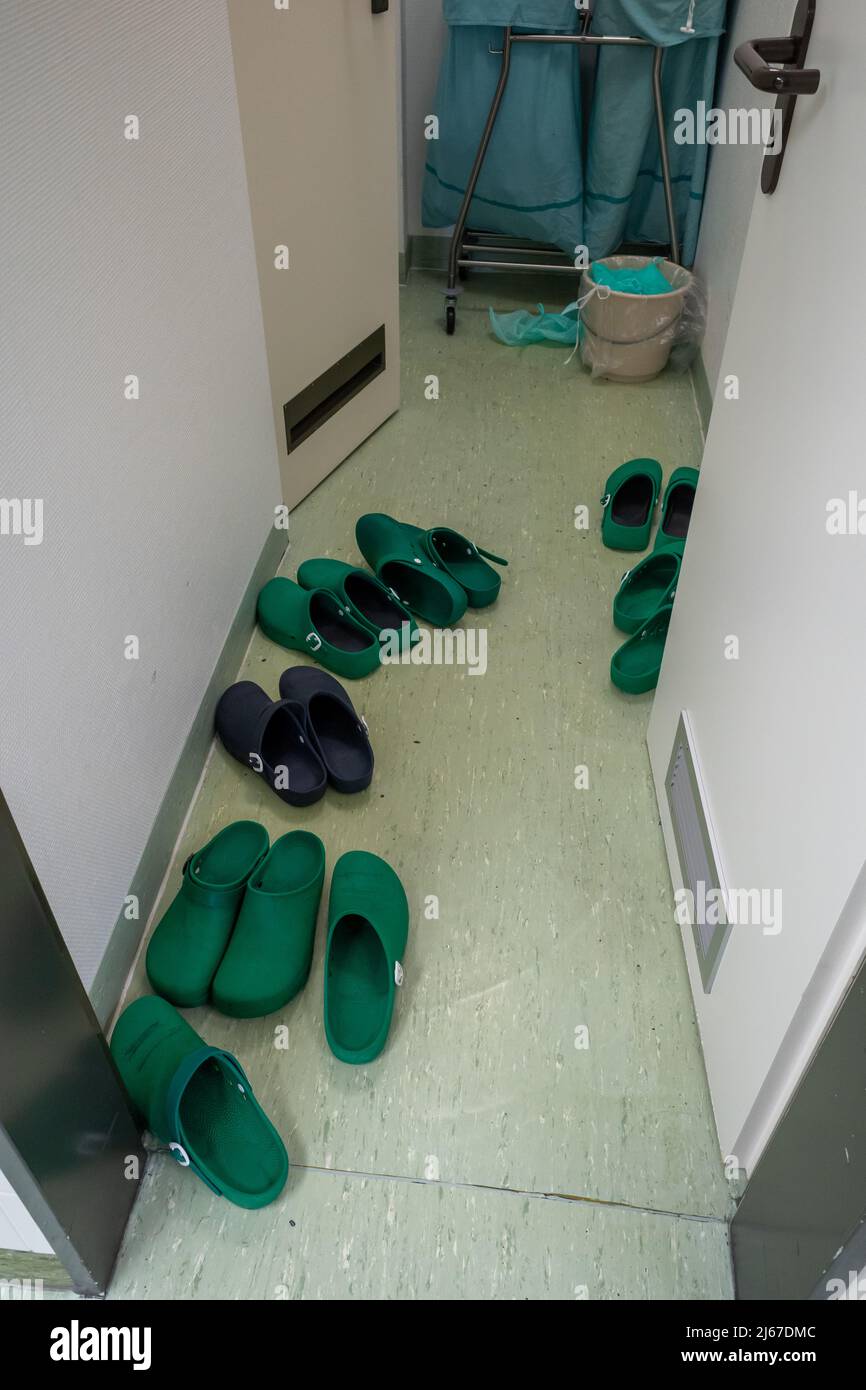 in a locker room next to an operating room are some used shoes Stock ...