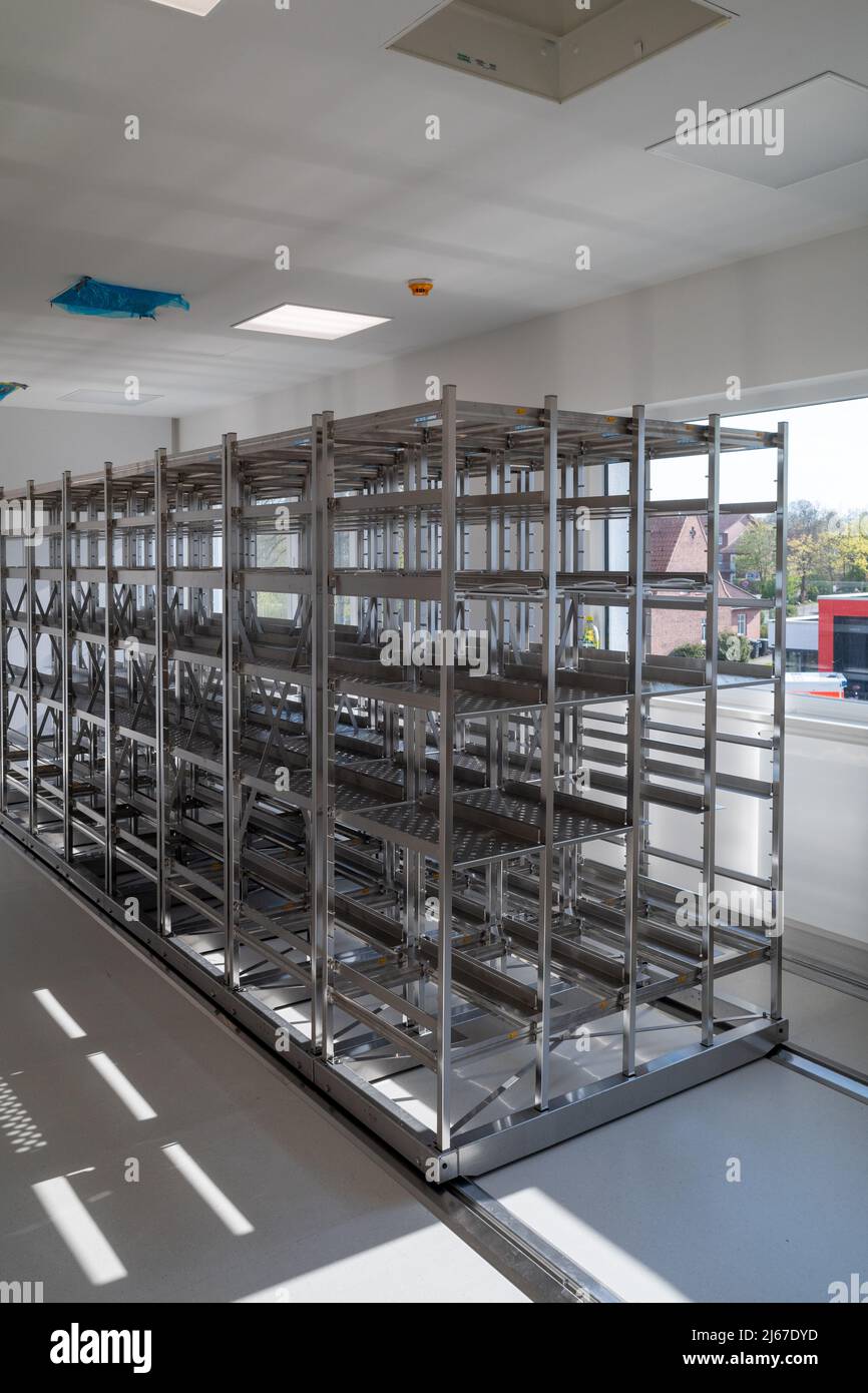 in a storage room for sterile instruments stands a new empty metal ...