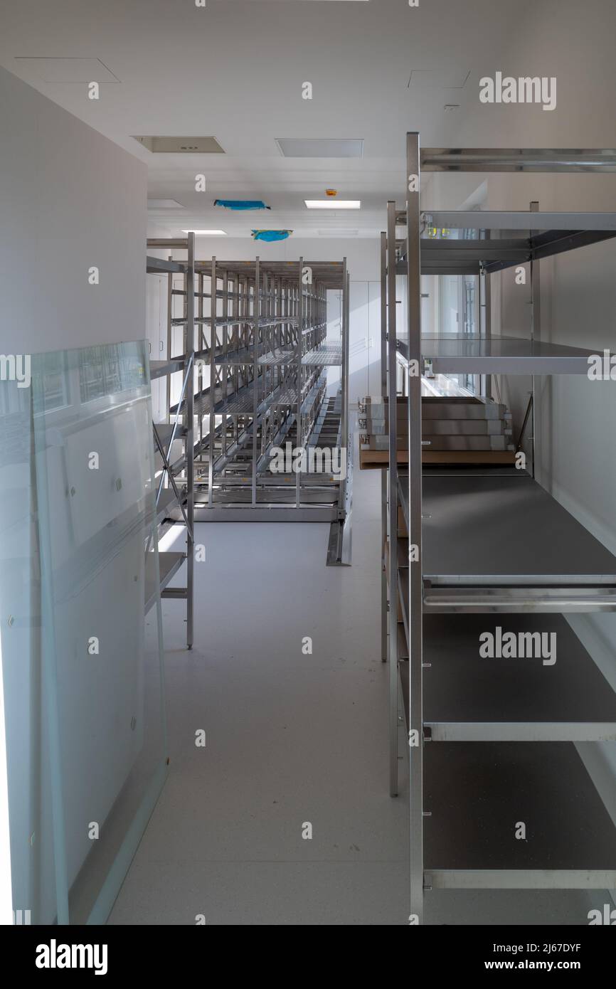 in a storage room for sterile instruments stands a new empty metal ...