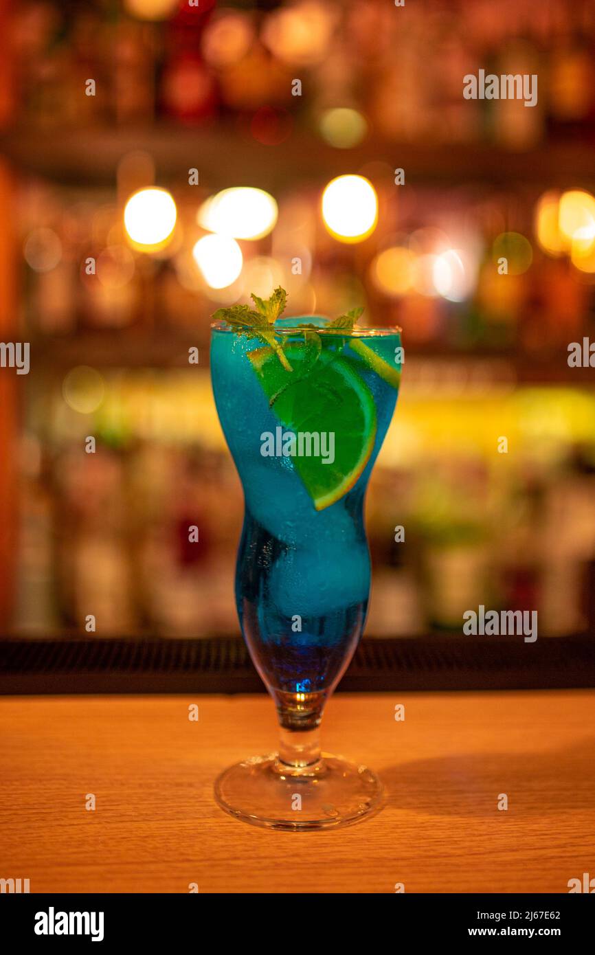 Glass of blue lagoon cocktail on the table Stock Photo - Alamy