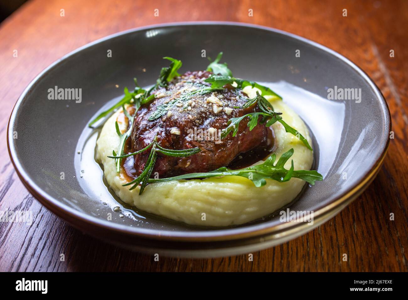 mashed potatoes with meat cutlet and herbs Stock Photo - Alamy