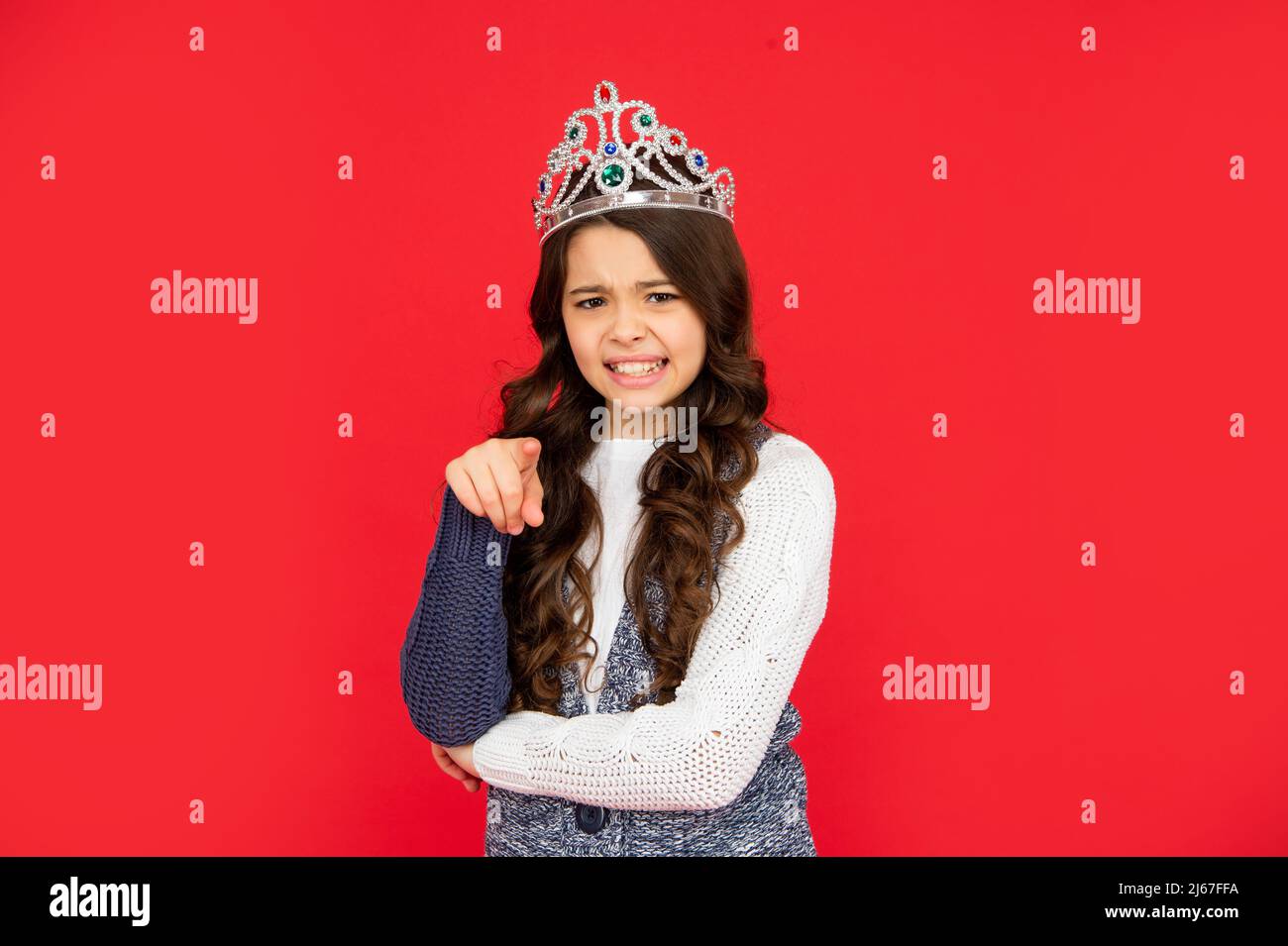 displeased child in queen crown. arrogant princess in tiara. kid ...