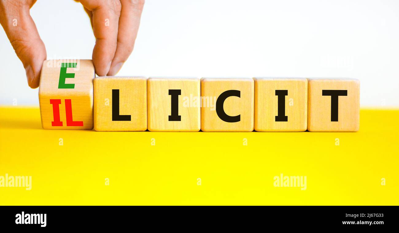 Illicit or elicit symbol. Businessman turns wooden cubes and changes ...