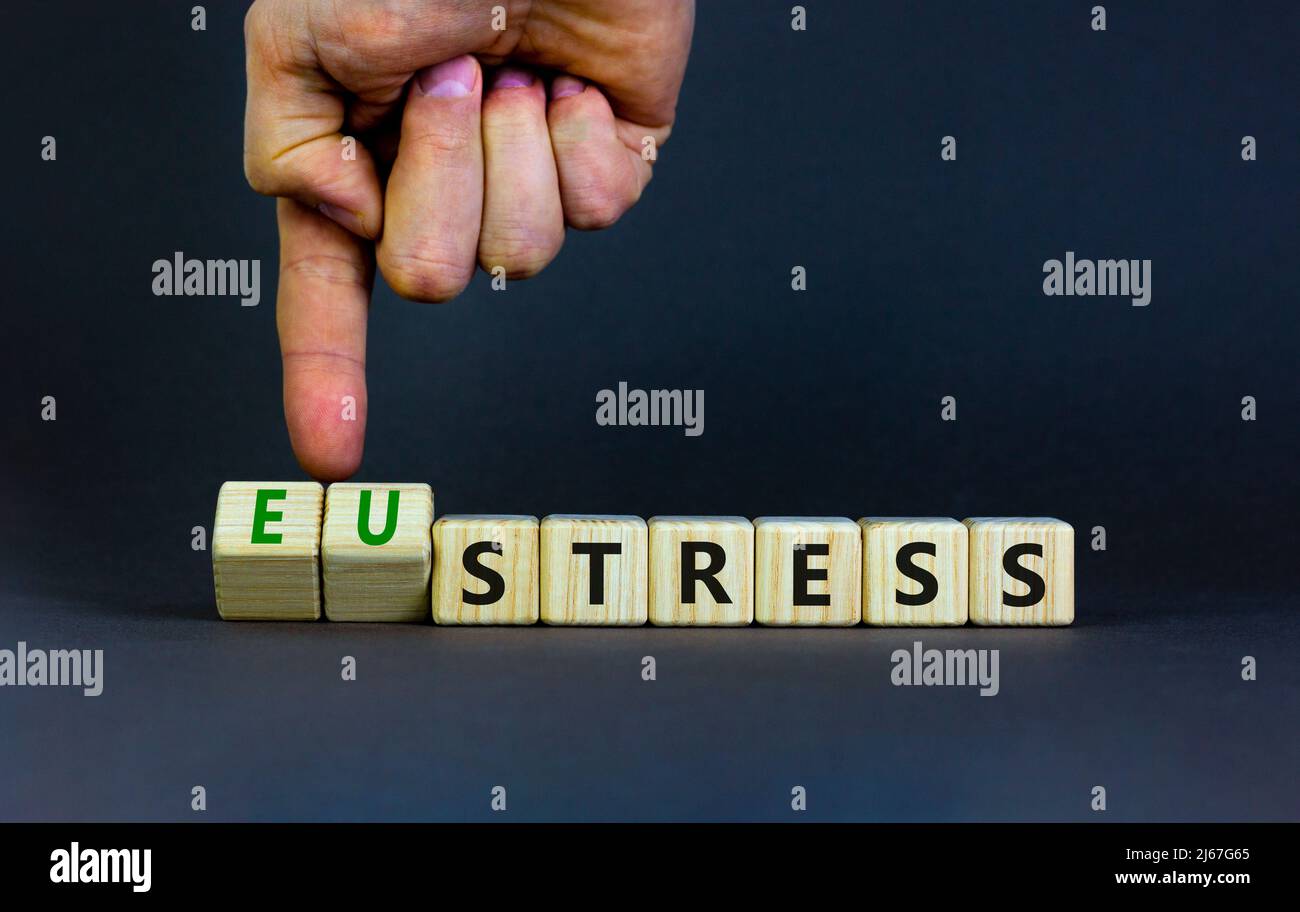 Eustress or stress symbol. Psychologist turns cubes and changes the ...