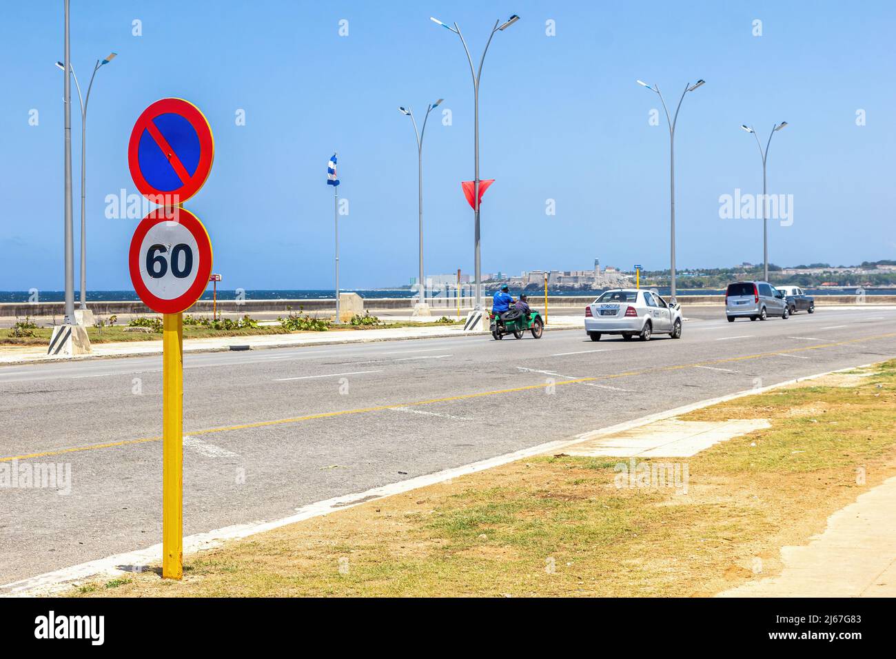 Traffic sign prohibiting parking (on top) and marking the maximum speed ...