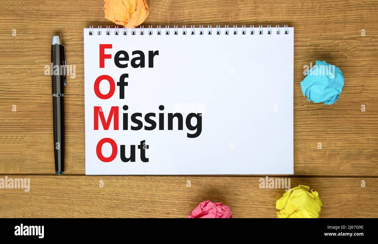 FOMO fear of missing out symbol. Concept words FOMO fear of missing out ...