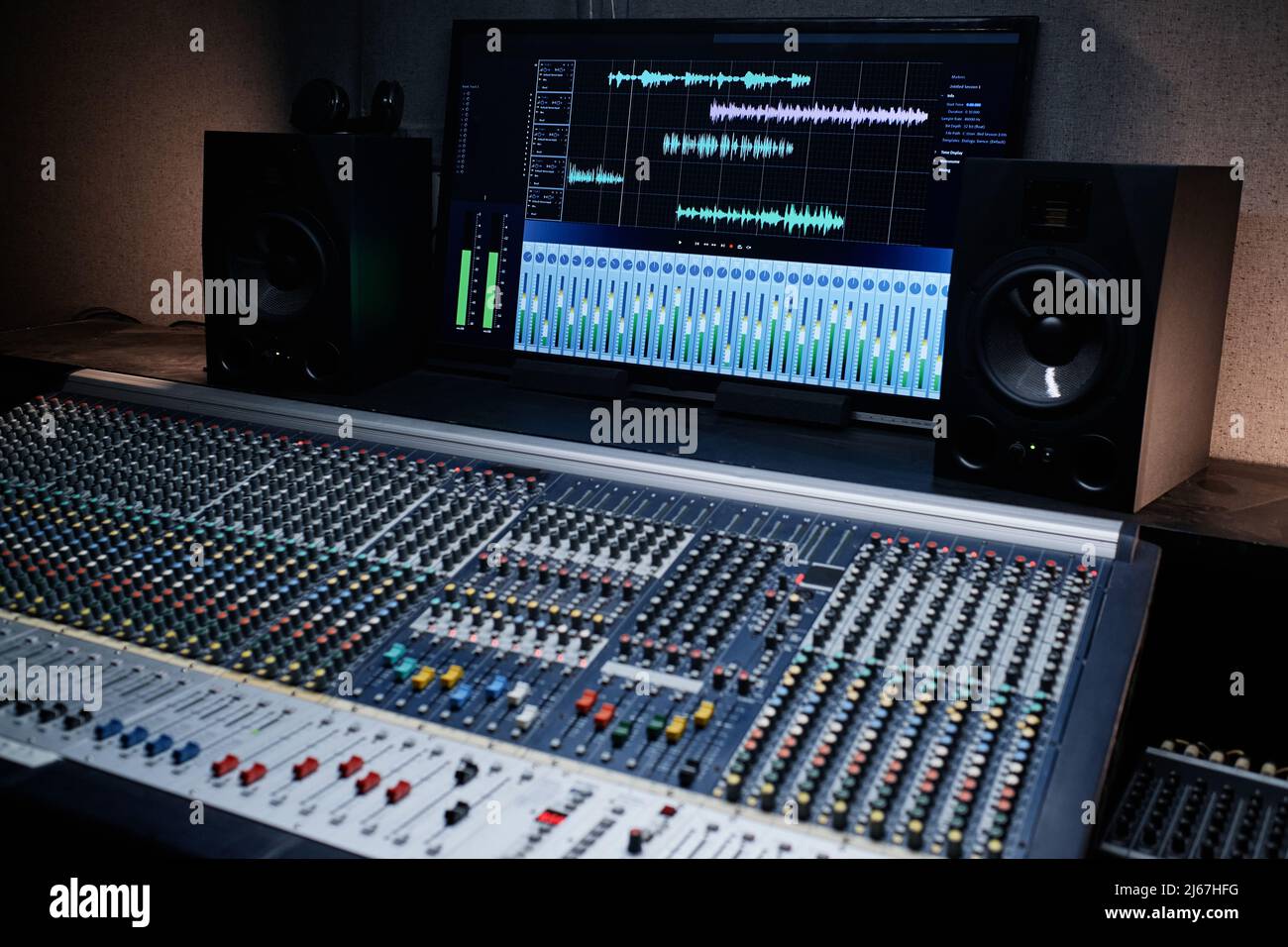 Horizontal no people shot of mixing console with sound settings and ...