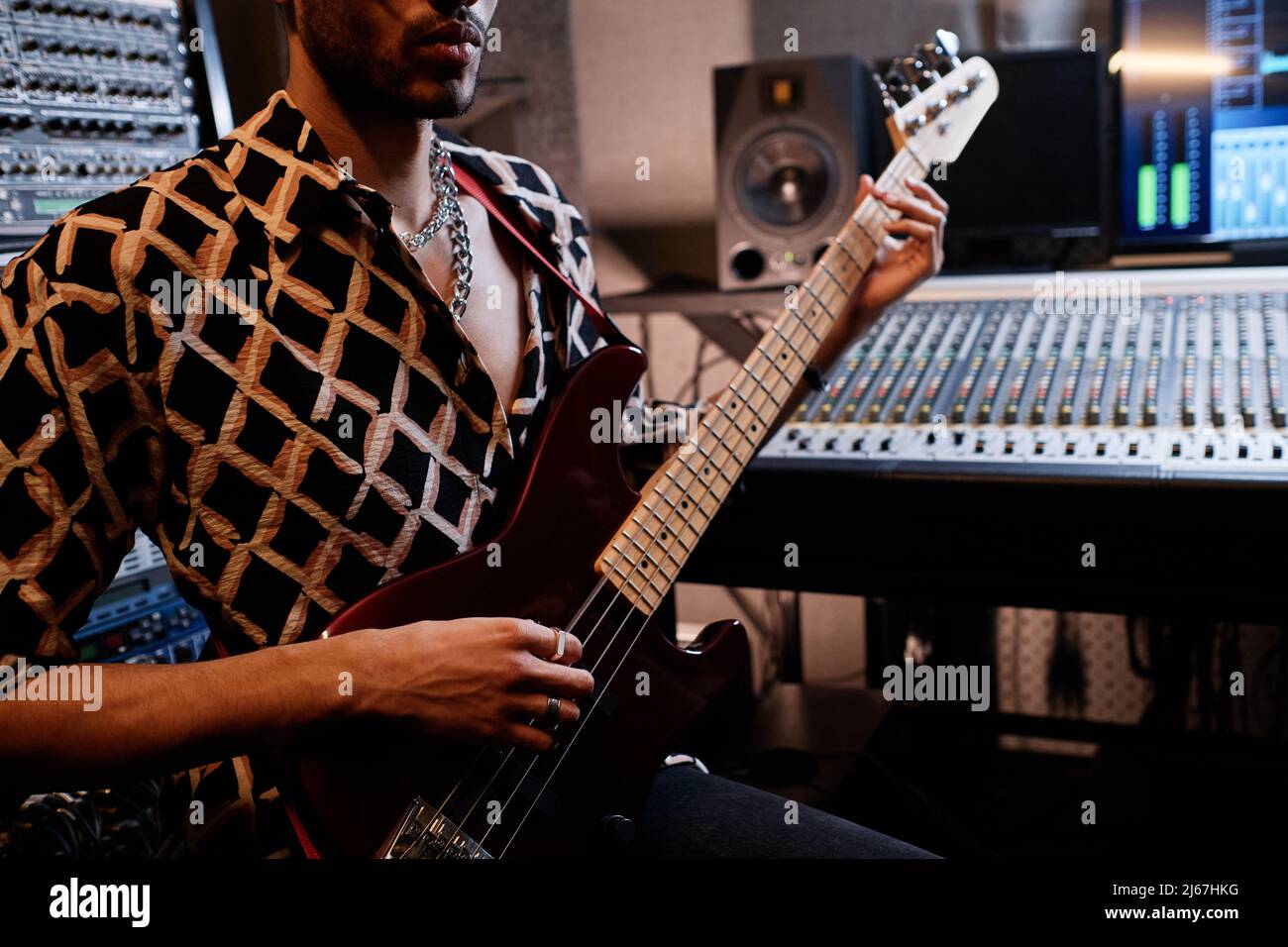 Medium section shot of stylish young Black rock musician playing ...