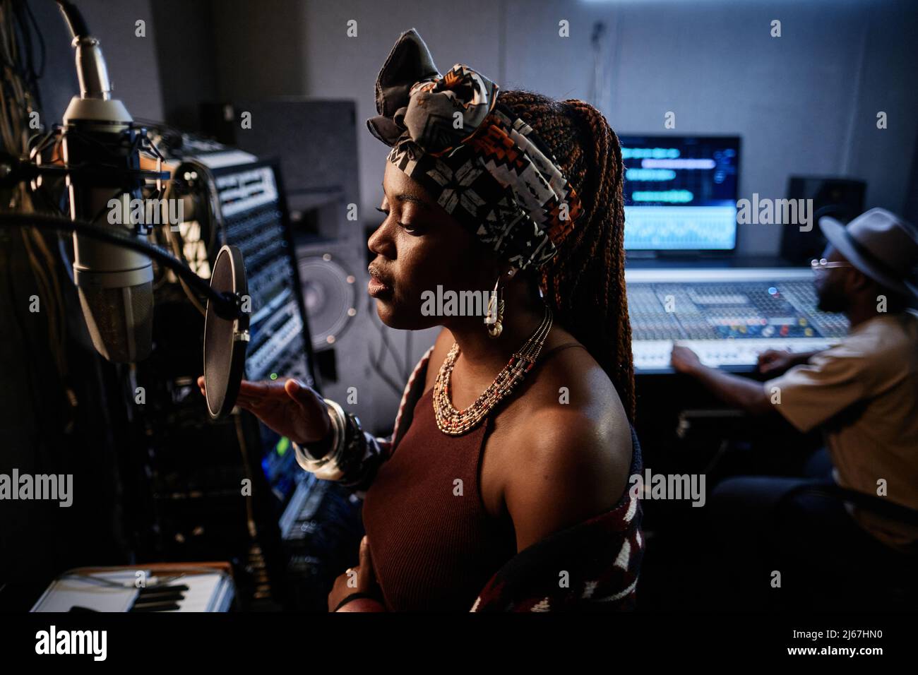 Beautiful young female professional singer wearing ethnic outfit ...