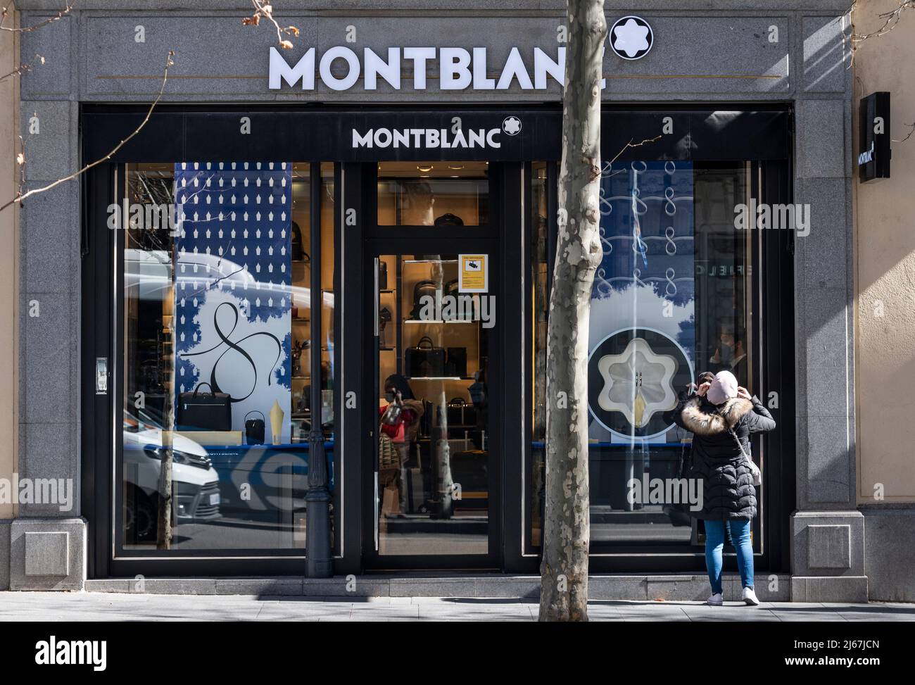 A woman stands in front of the German manufacturer of luxury writing ...