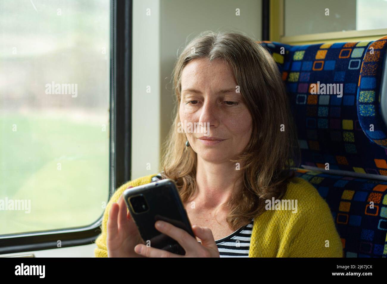 Smiling girl in subway train hi-res stock photography and images - Alamy