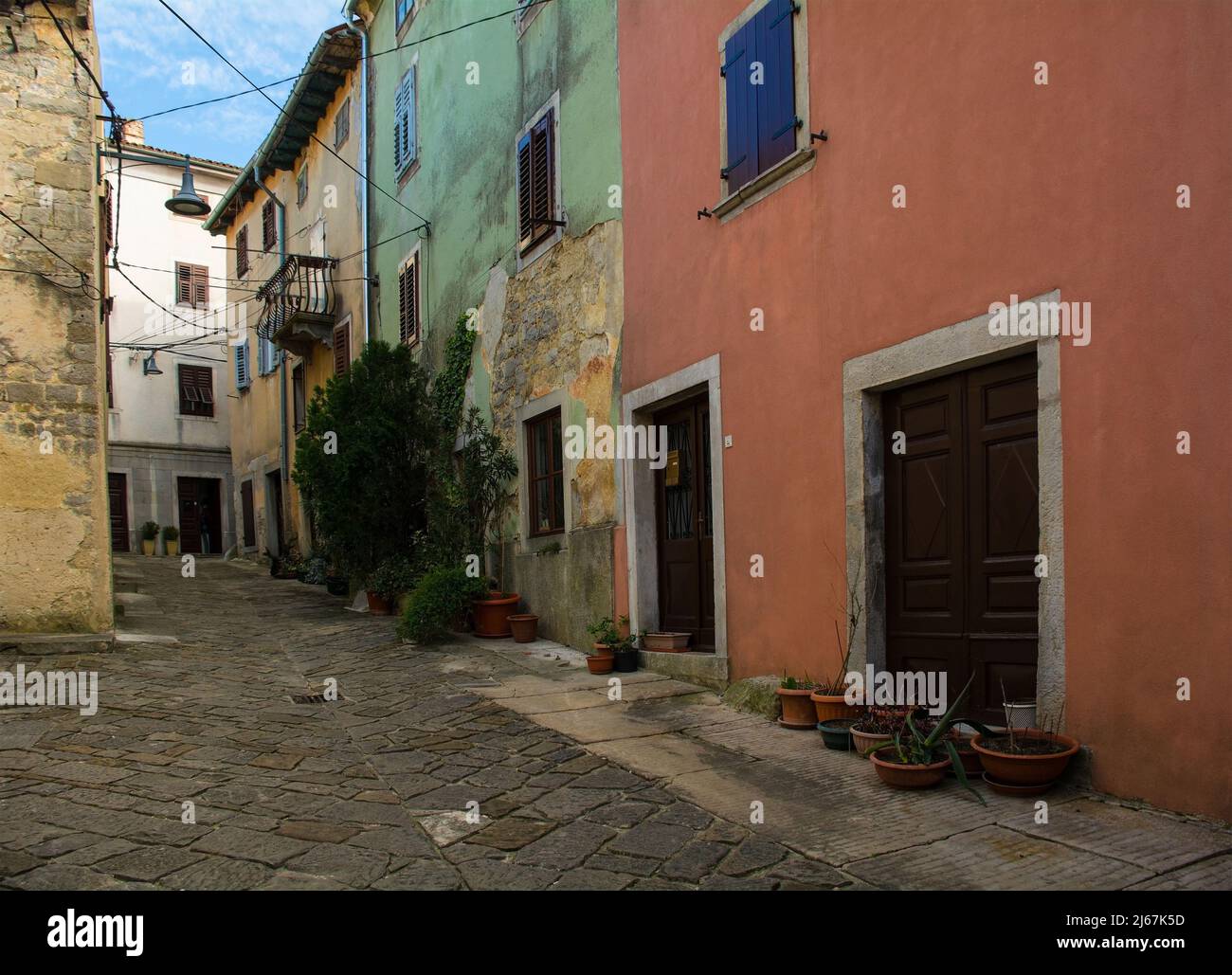 An historic residential street in the medieval hill village of Buzet in ...