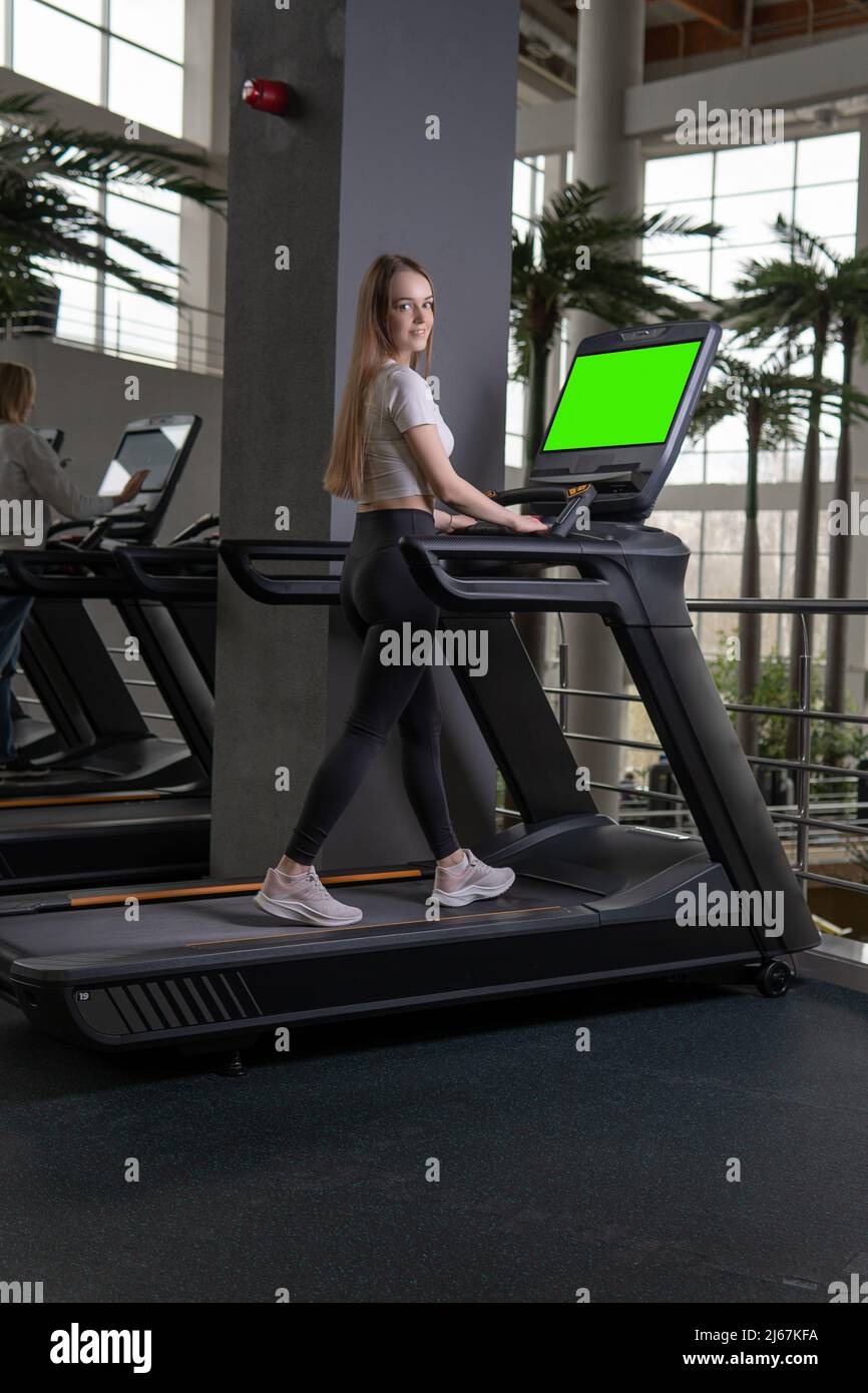 Indoors young treadmill woman length profile full running sport, from ...