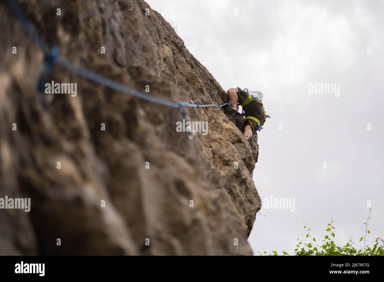 Strong senior female climber climbing hi-res stock photography and ...