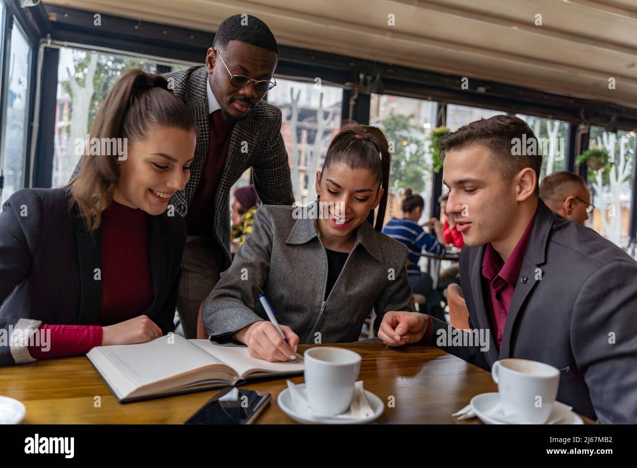 Group of multiracial business people are making plans Stock Photo - Alamy