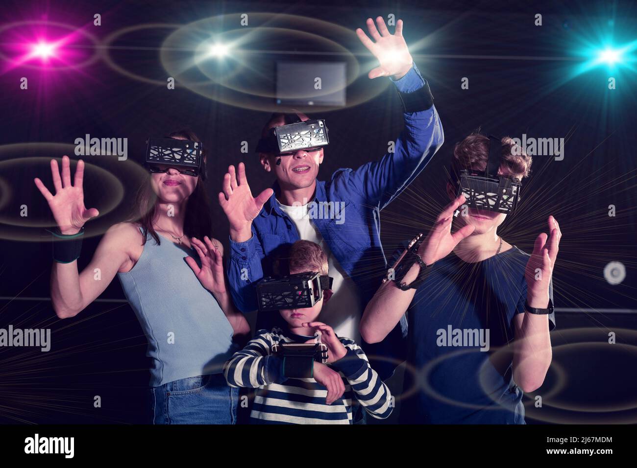 Emotional family having fun with vr headset goggles Stock Photo - Alamy