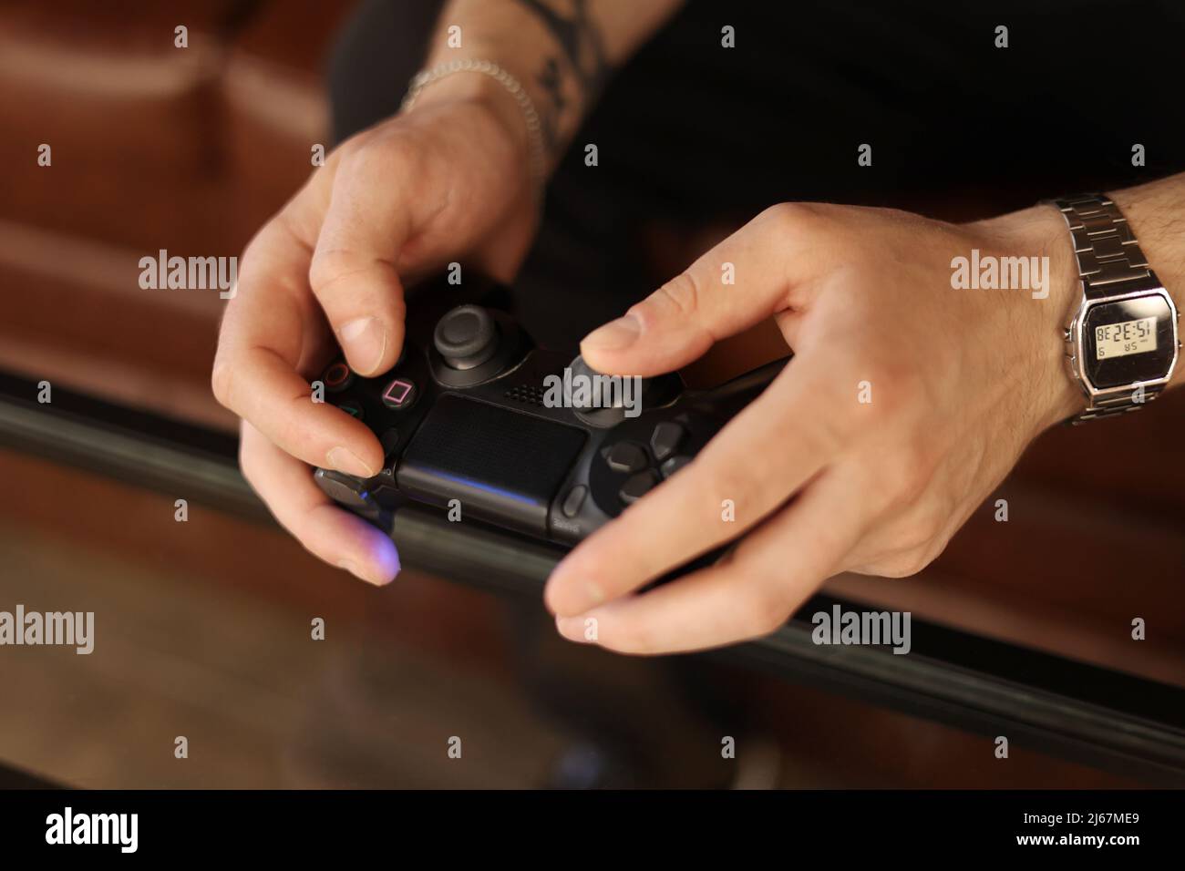 Playing games concept. Part body man with joystick play game on console ...