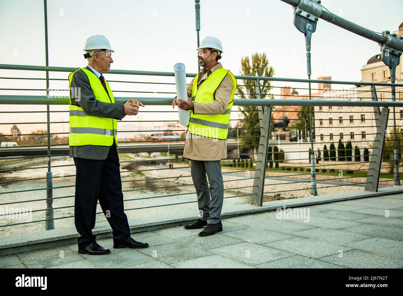 Engineer looking at bridge and plans hi-res stock photography and ...