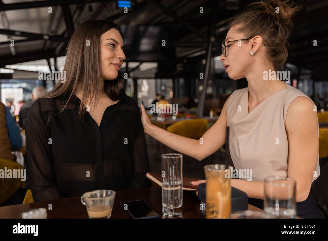 Group of young business people are having a serious talk about their ...