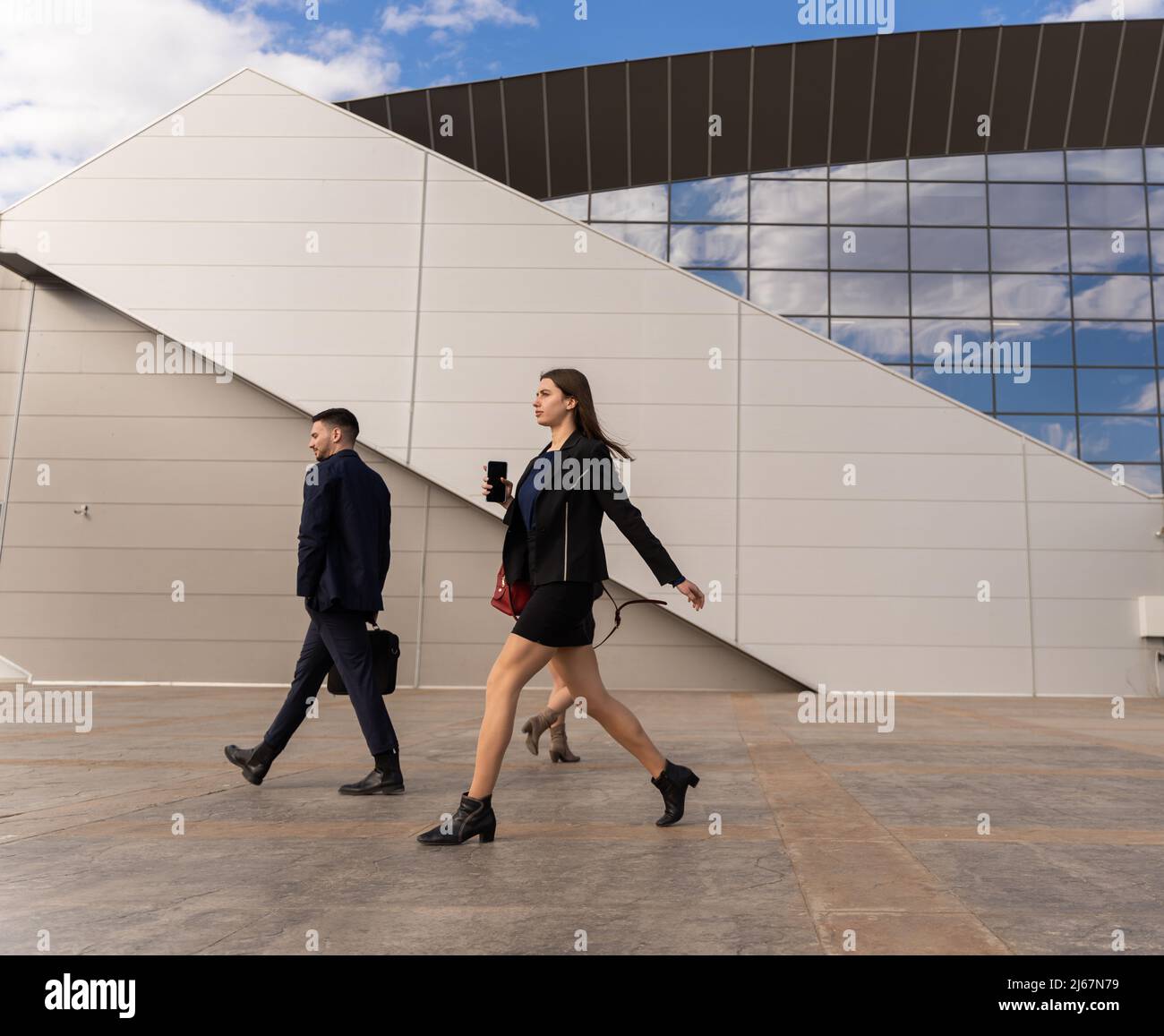 Group of young business people are walking fast on their break while ...