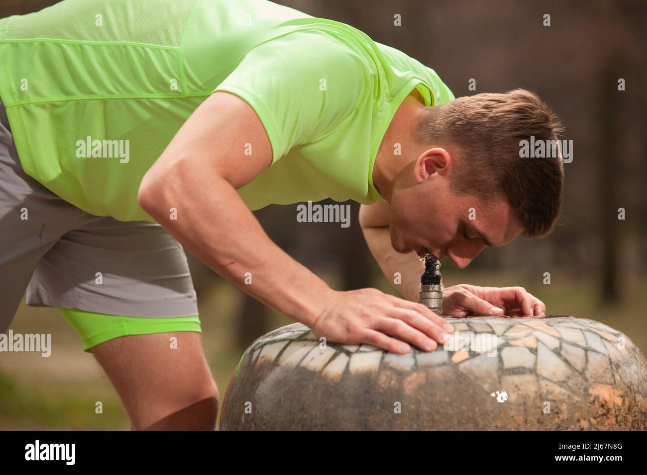 Muscular men drinking water from hi-res stock photography and images ...