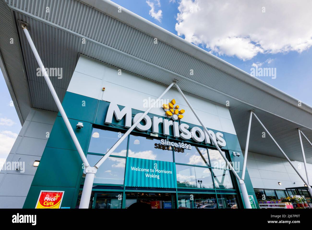 Morrisons name and logo above the entrance to its supermarket in Woking ...