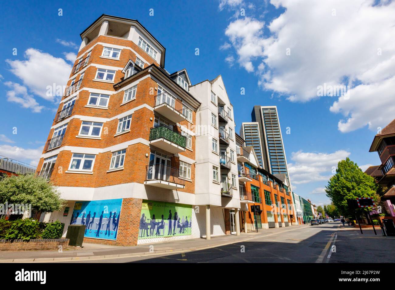 View along Goldsworth Road towards the town centre with the towers of ...