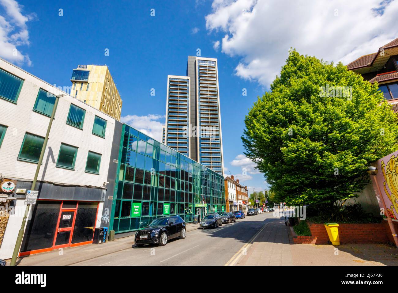 View along Goldsworth Road towards the town centre with the towers of ...