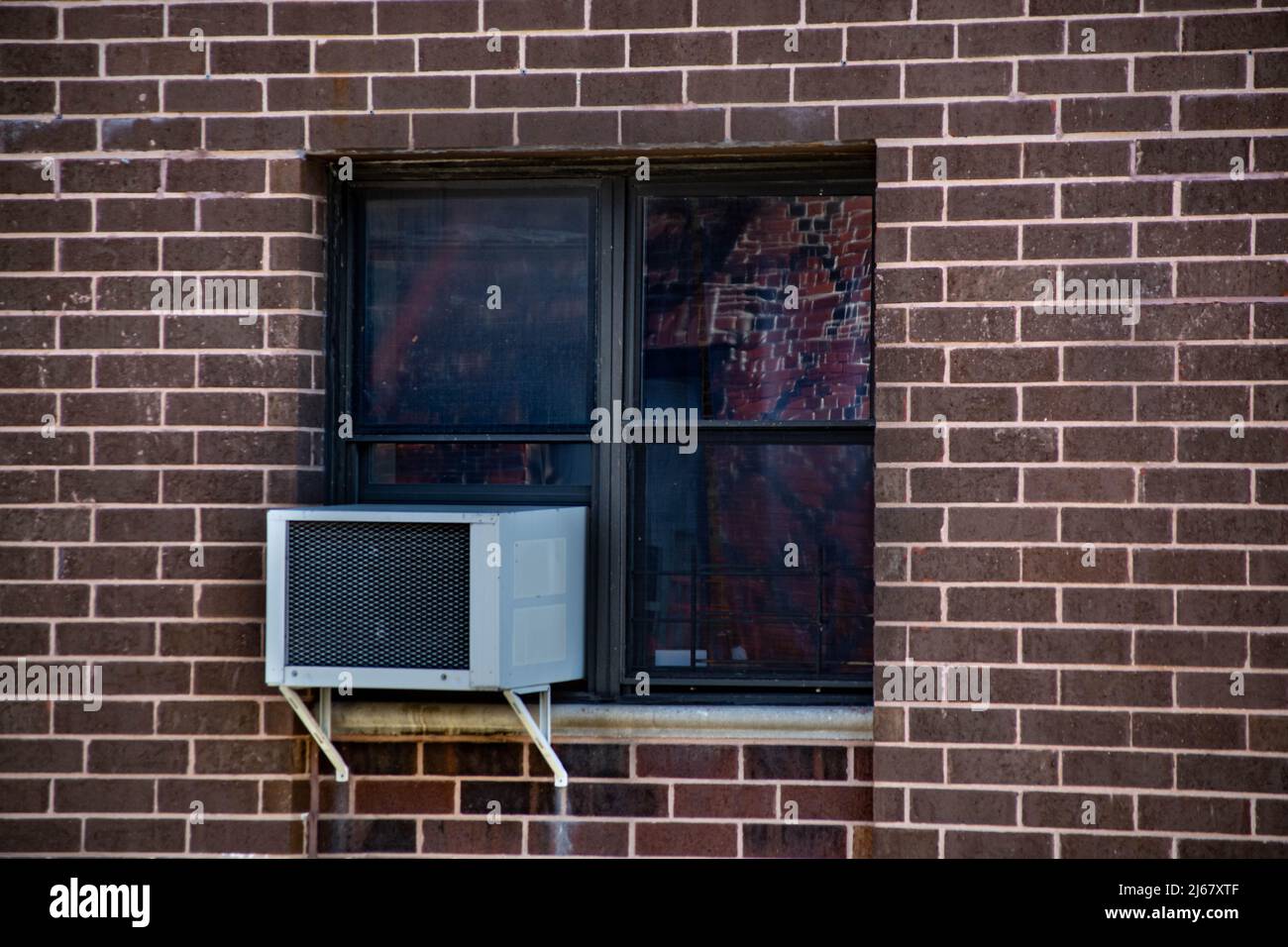 Window and AC in the brick building Stock Photo - Alamy