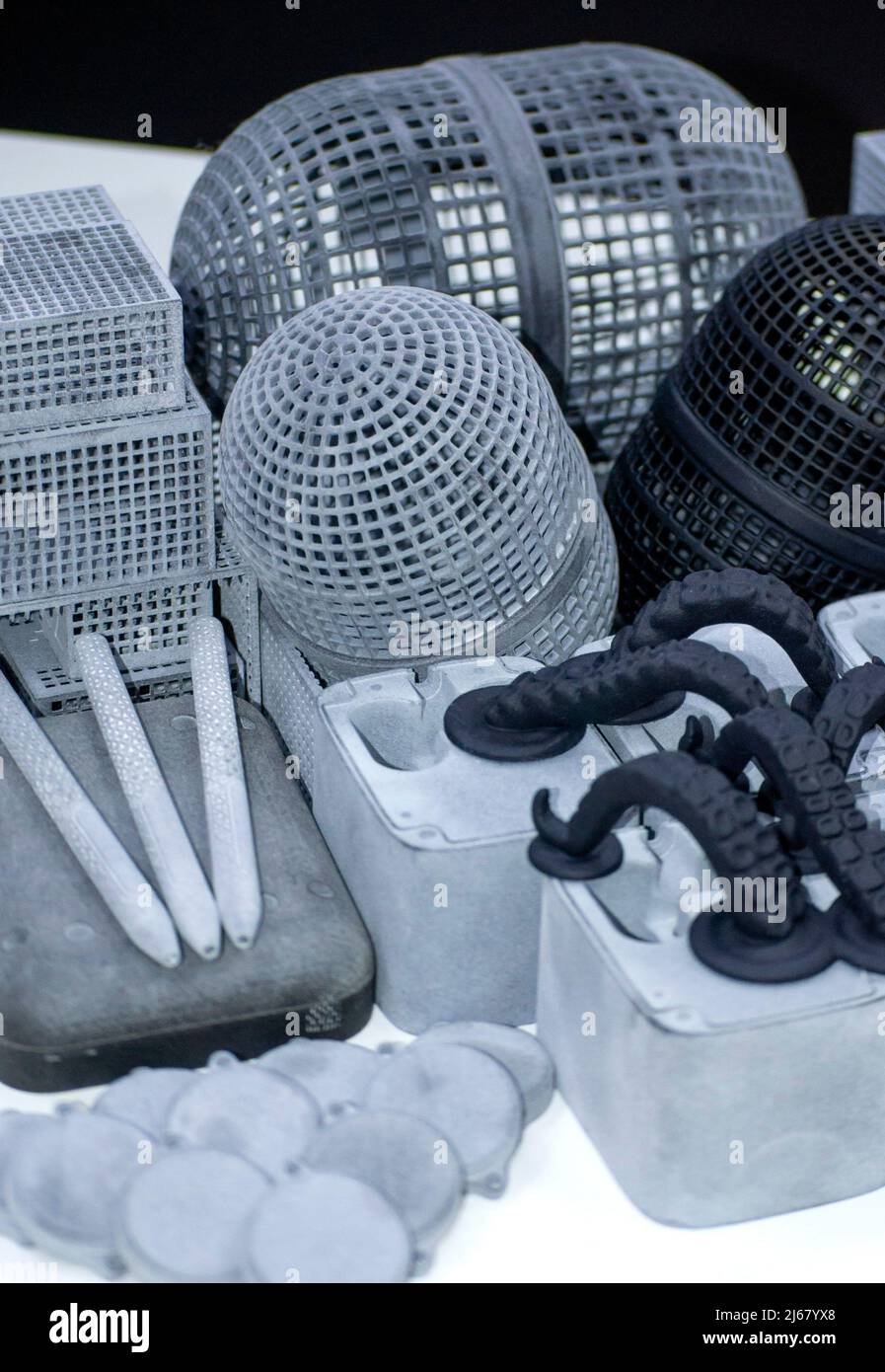 Many models printed on 3D printer. Gray and black objects printed 3D ... Many models printed on 3D printer. Gray and black objects printed 3D ...