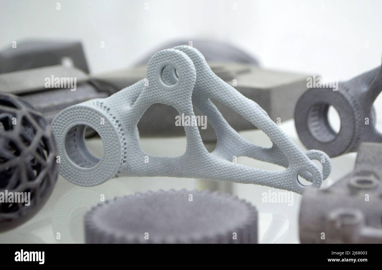 Many models printed on 3D printer. Gray and black objects printed 3D ... Many models printed on 3D printer. Gray and black objects printed 3D ...