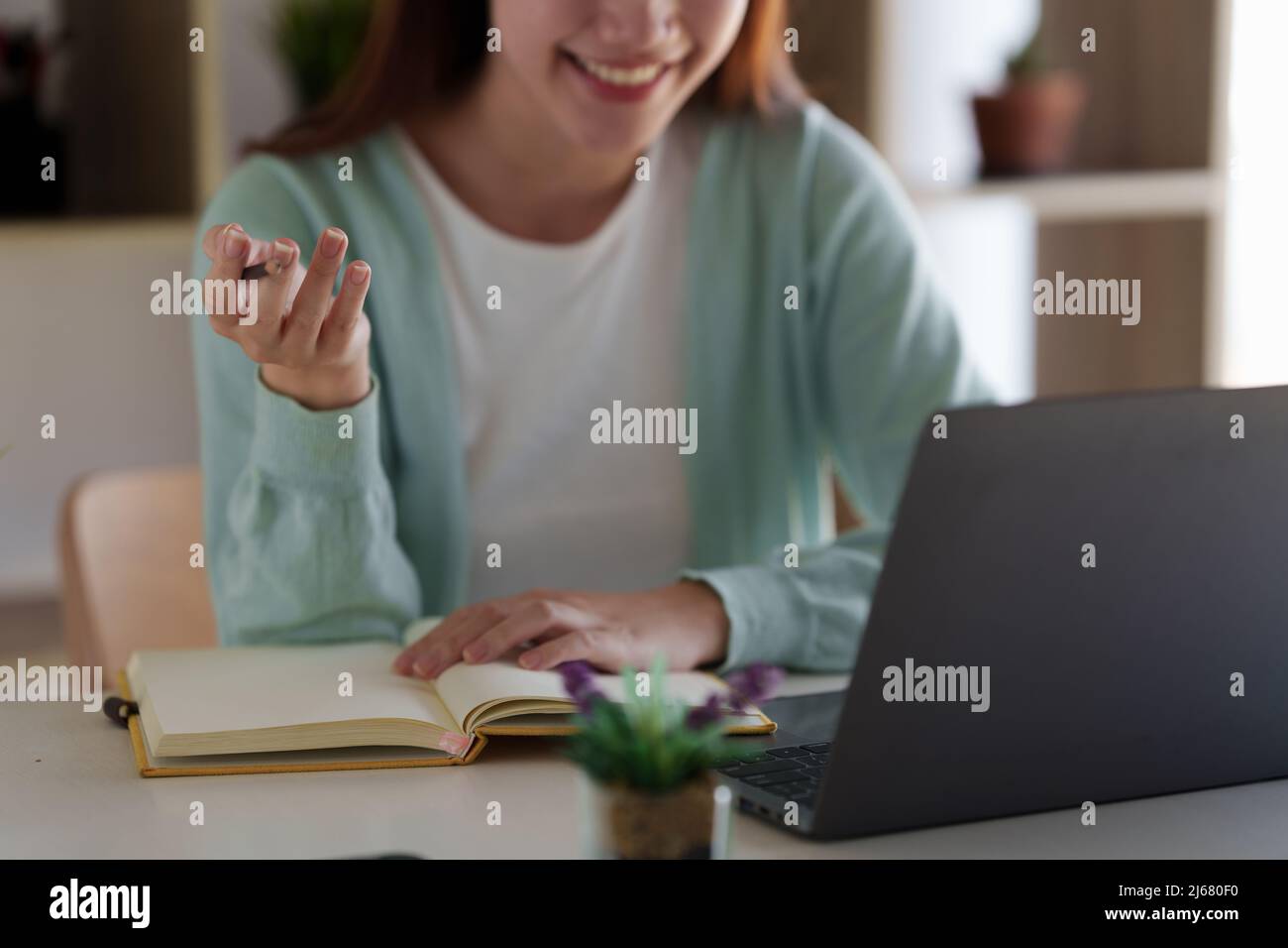 Young college student have question and answer to teacher by video call ...