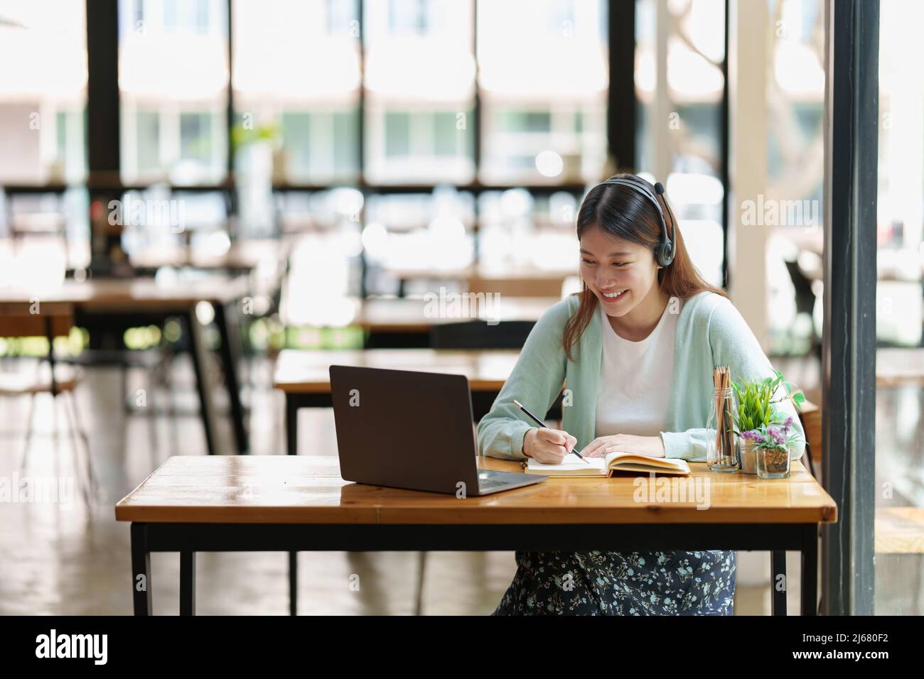 Young college student have question and answer to teacher by video call ...
