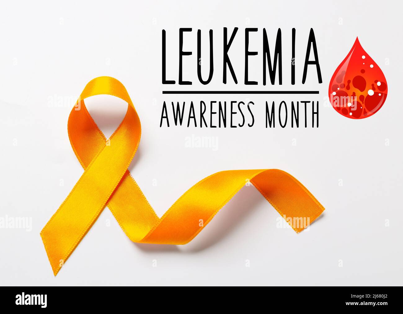 Orange ribbon and text LEUKEMIA AWARENESS MONTH on light background ...