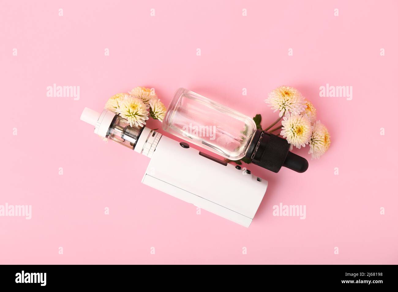 Modern vape mod, oil and flowers on pink background Stock Photo - Alamy