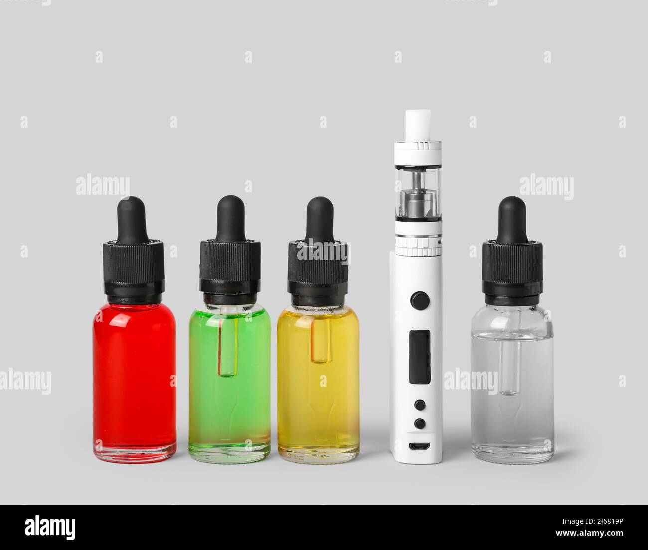 Modern vape mod and oils on light background Stock Photo - Alamy